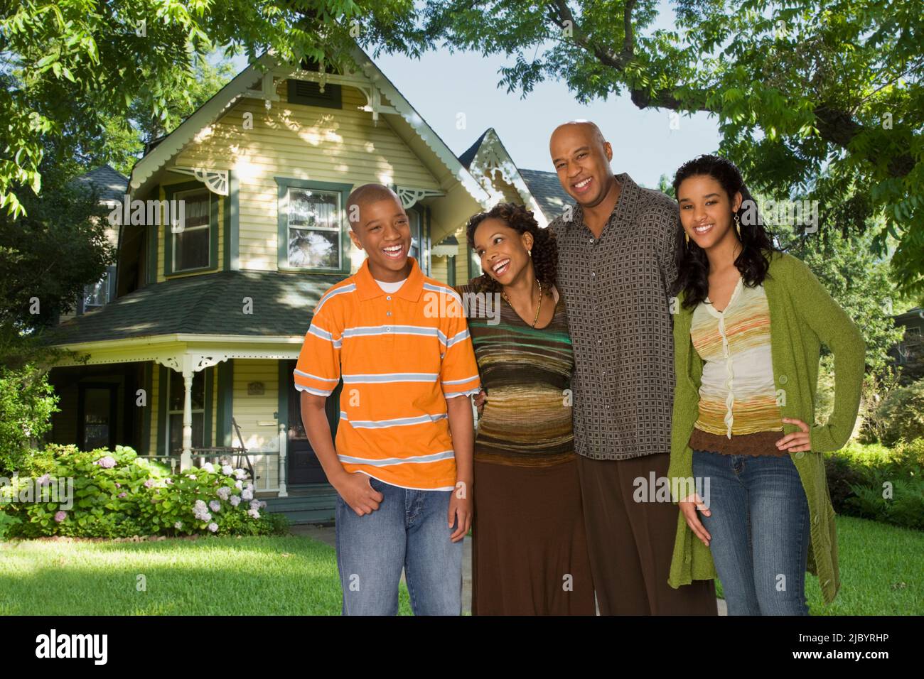 Family standing in yard together Stock Photo - Alamy