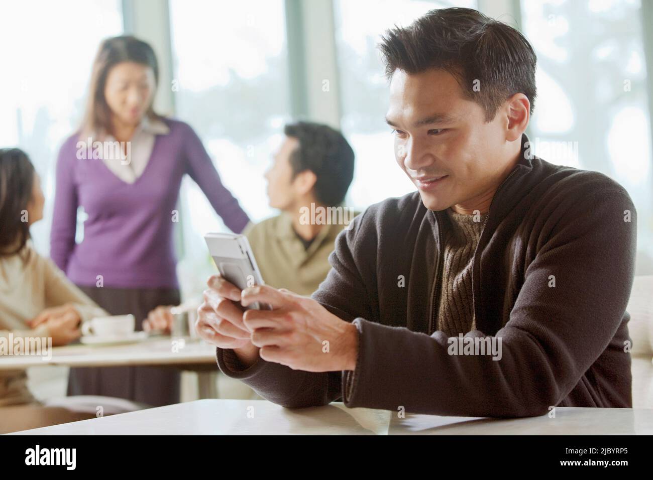 Asian man cell phone looking reading texting messaging woman hi-res ...