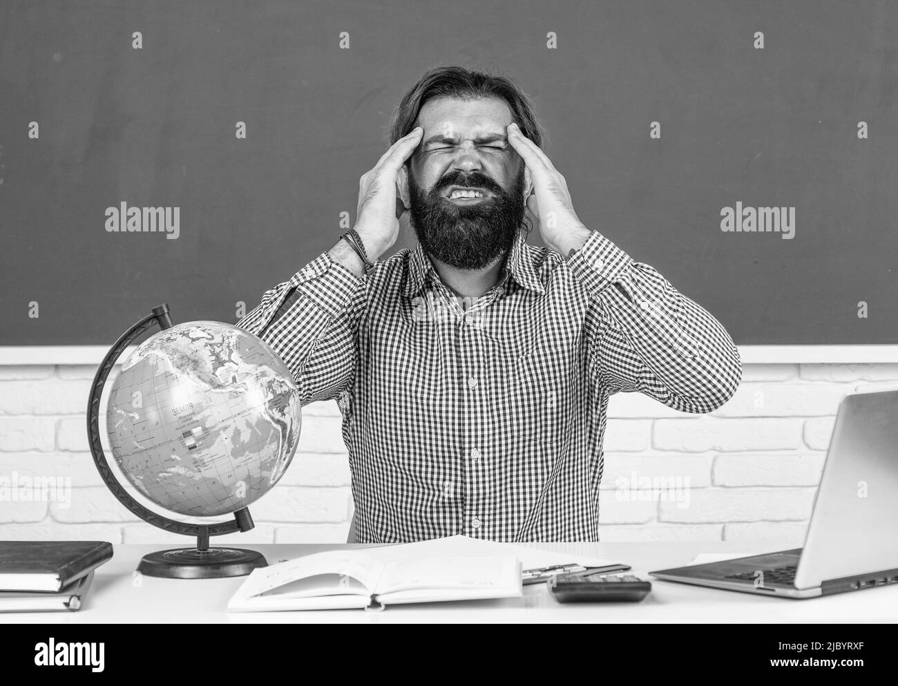 troubles in studying. formal education. male student sit in school ...