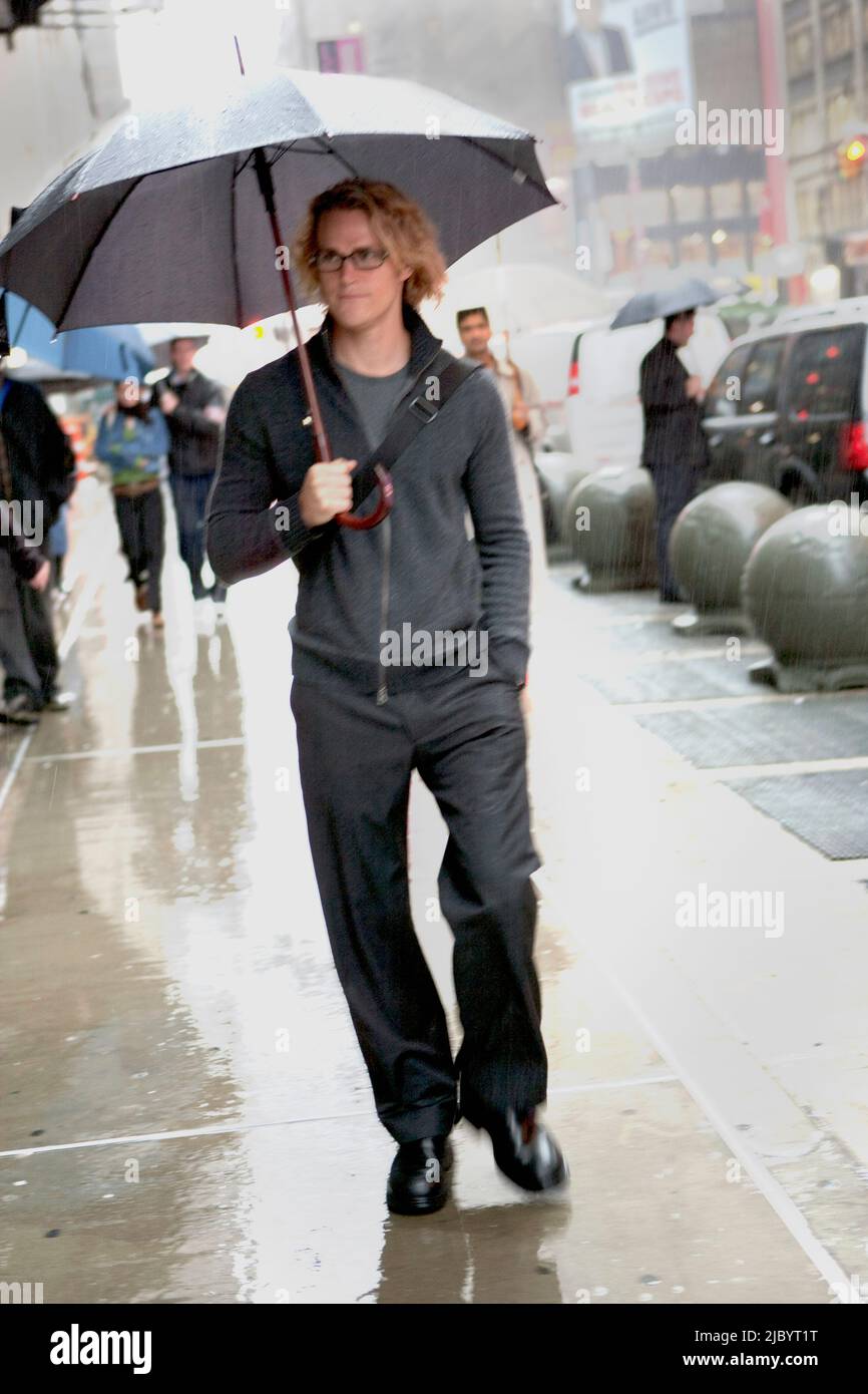 Men walking in rain wet hair hi-res stock photography and images - Alamy