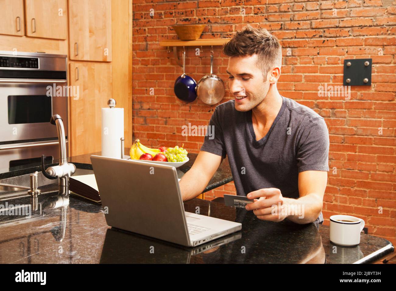Caucasian man shopping online with credit card Stock Photo - Alamy