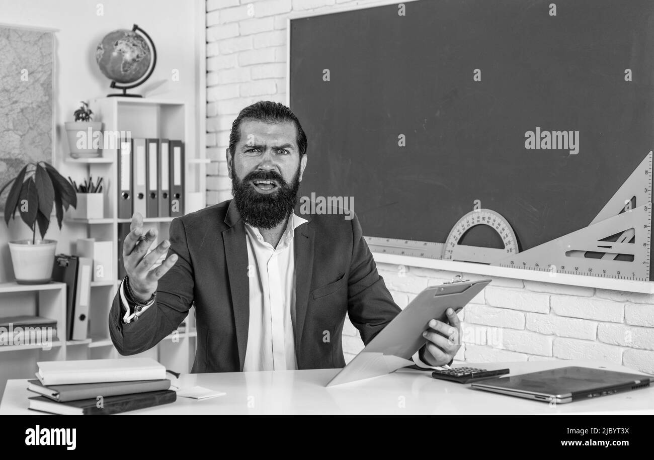 mature bearded teacher at lesson. brutal bearded man work in classroom ...