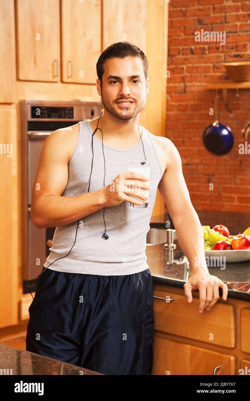 Hispanic man drinking milk after exercise Stock Photo - Alamy