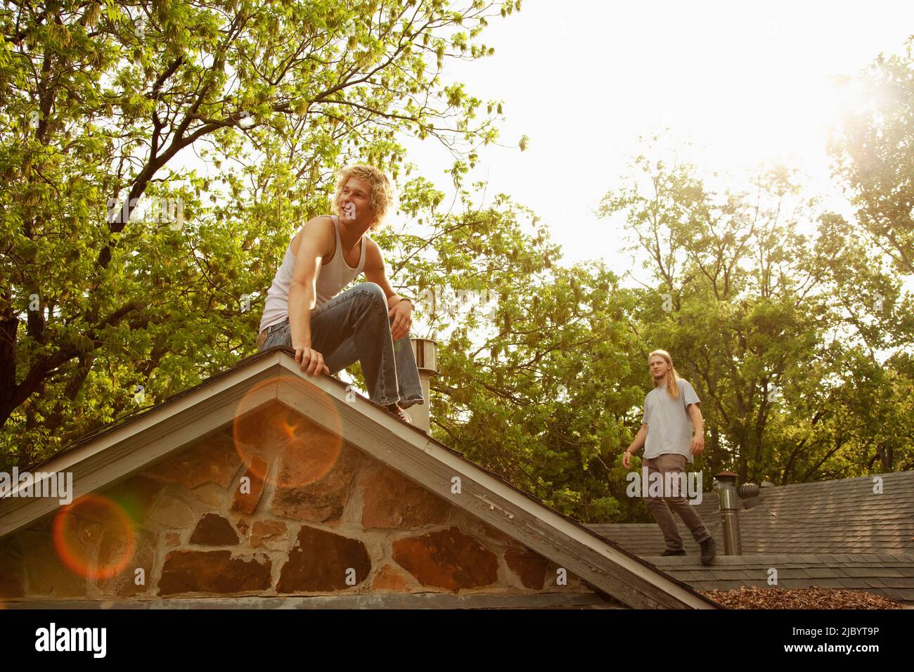 Friends walking on roof Stock Photo - Alamy
