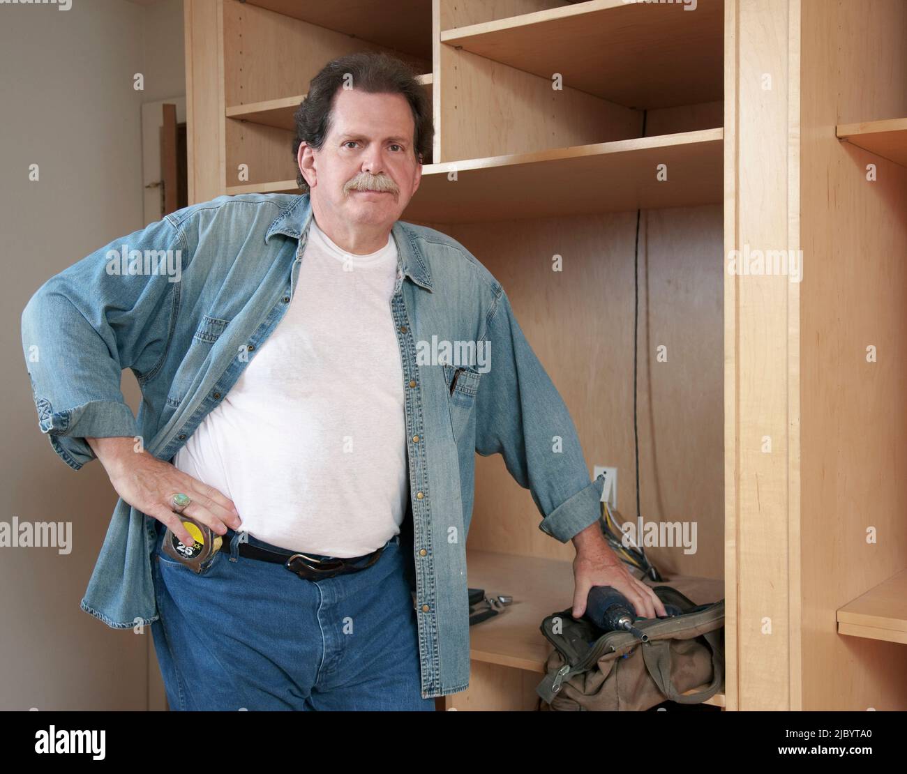 Man building cabinet Stock Photo - Alamy