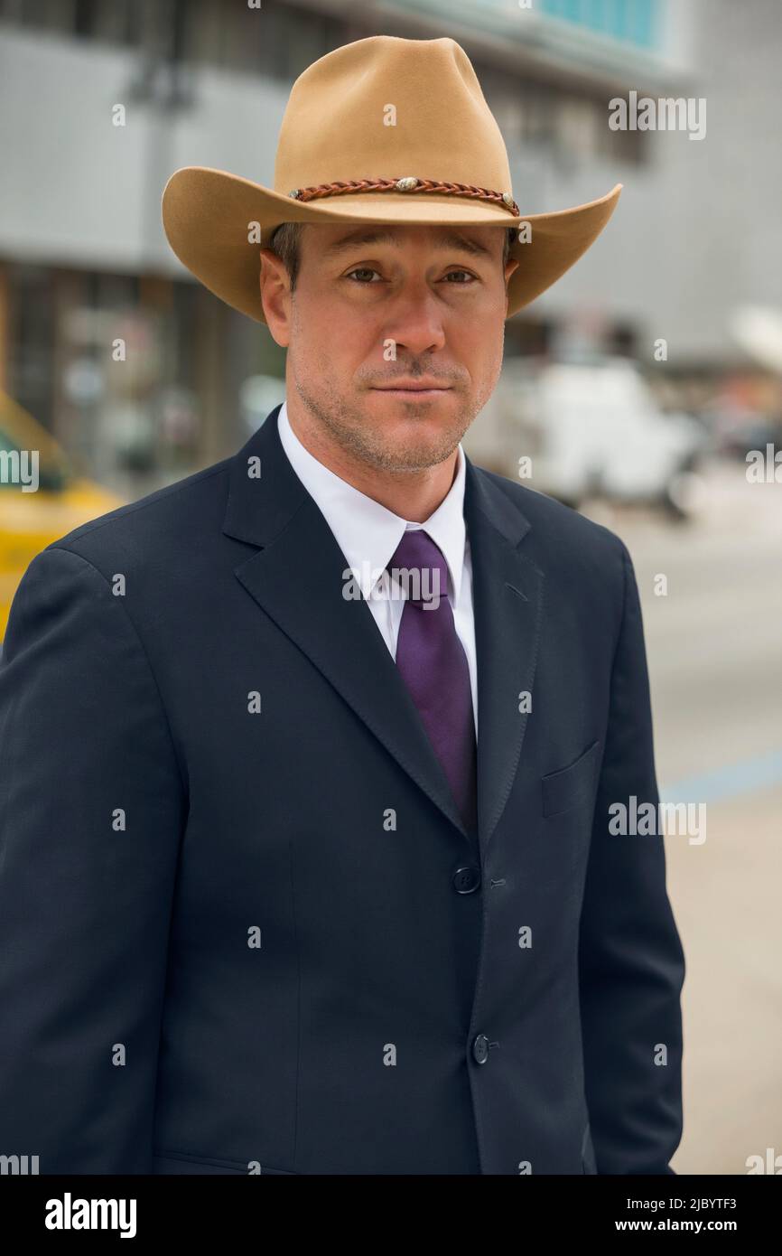 Smiling man in cowboy hat hi-res stock photography and images - Alamy