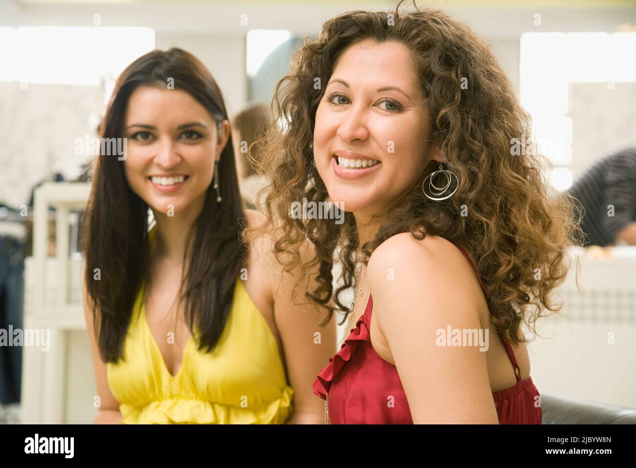 Multi-ethnic women smiling Stock Photo - Alamy