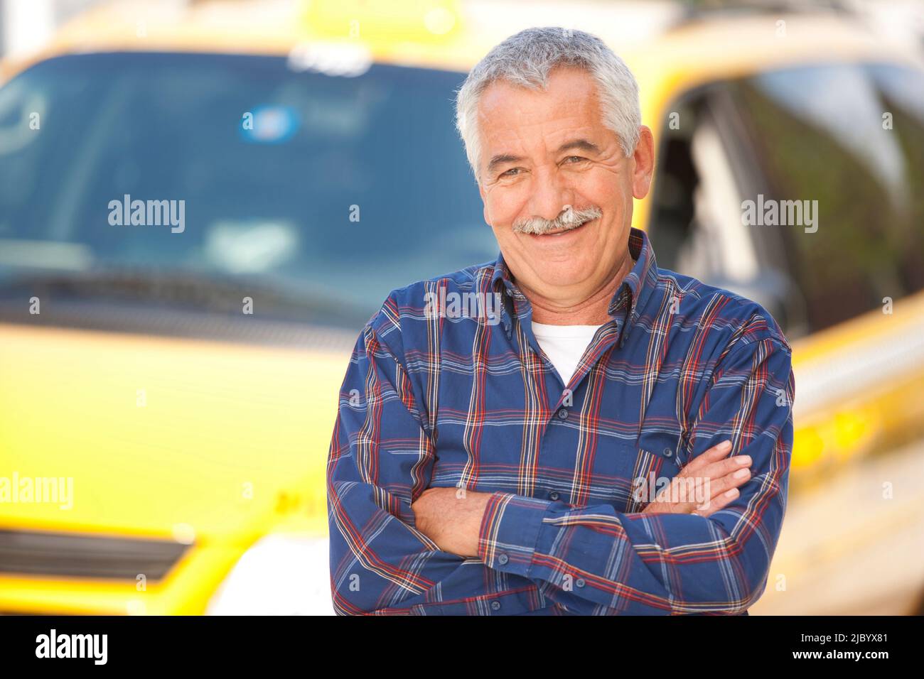 Middle Eastern man posing in front of taxi Stock Photo - Alamy