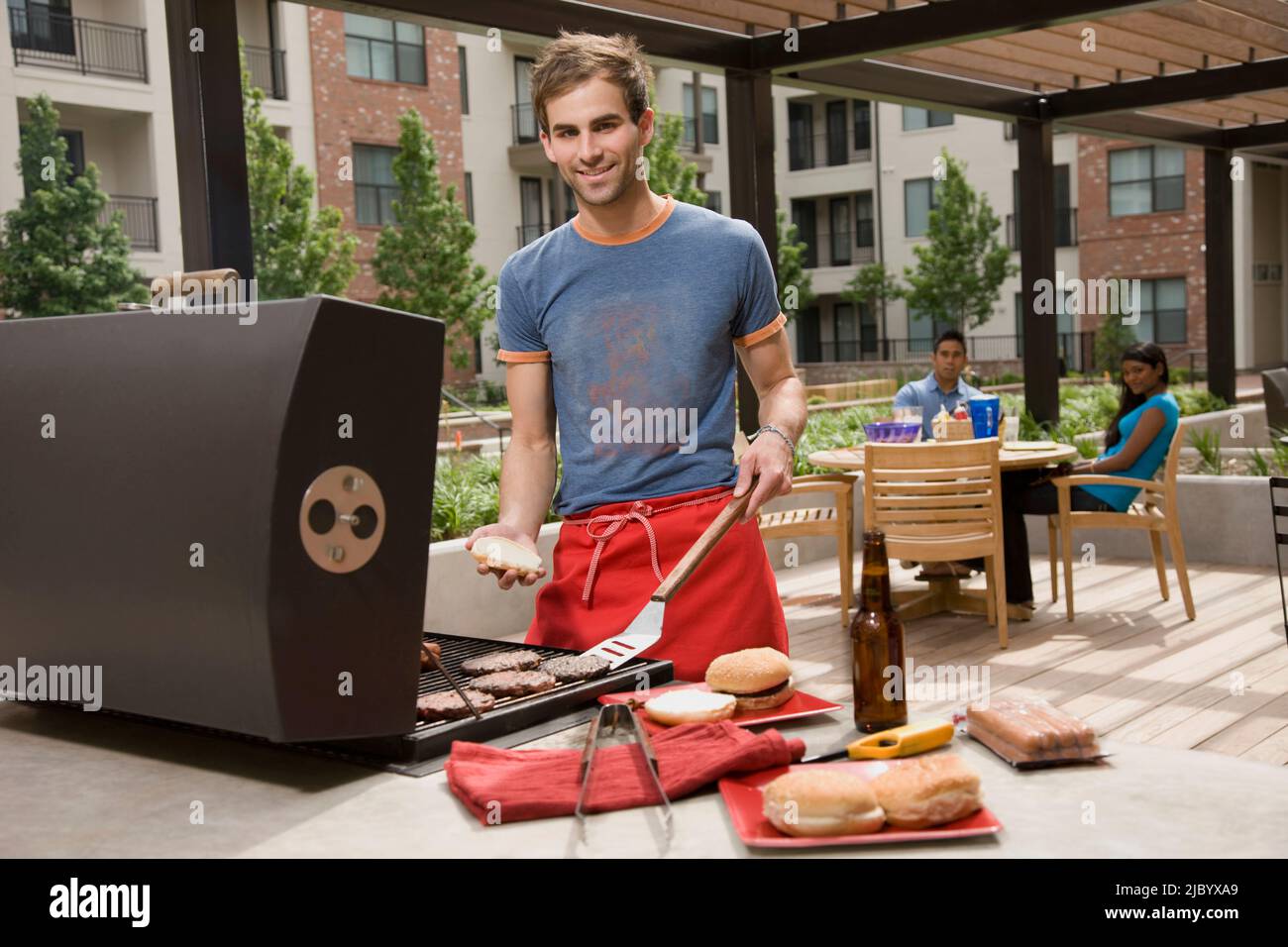 People at barbecue on patio Stock Photo - Alamy