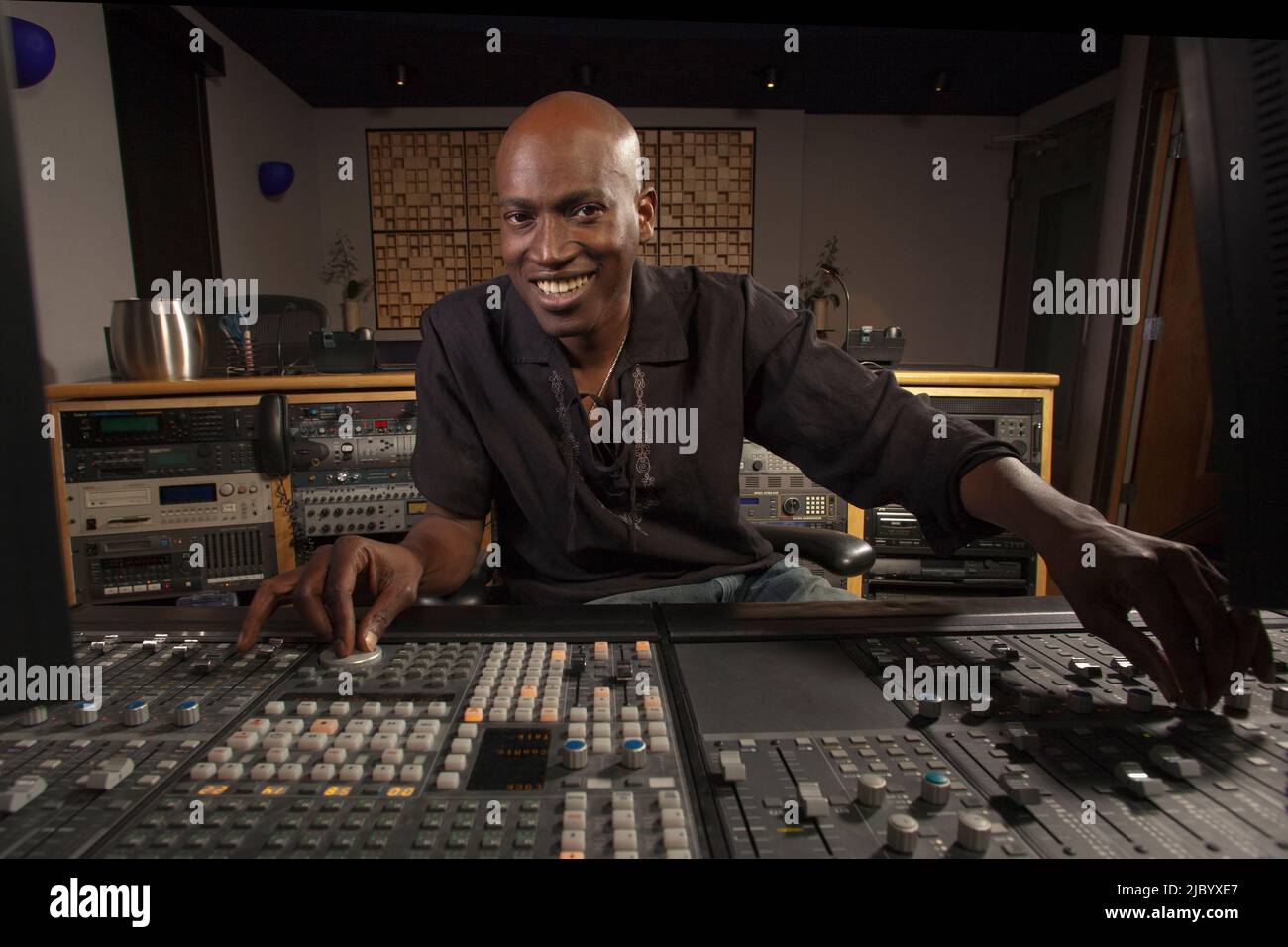 African American man working at audio control panel Stock Photo - Alamy