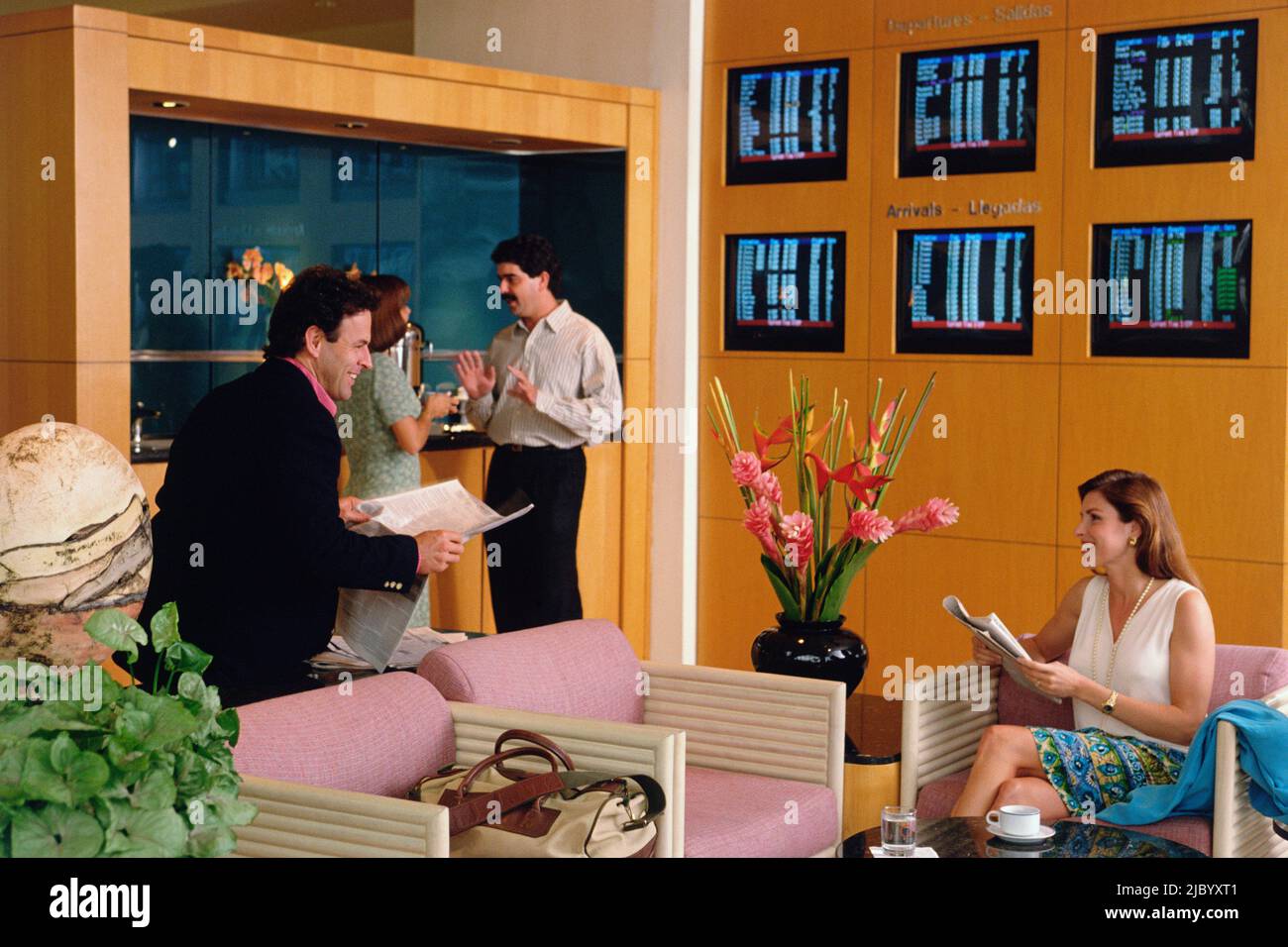 People waiting in VIP lounge at airport Stock Photo - Alamy