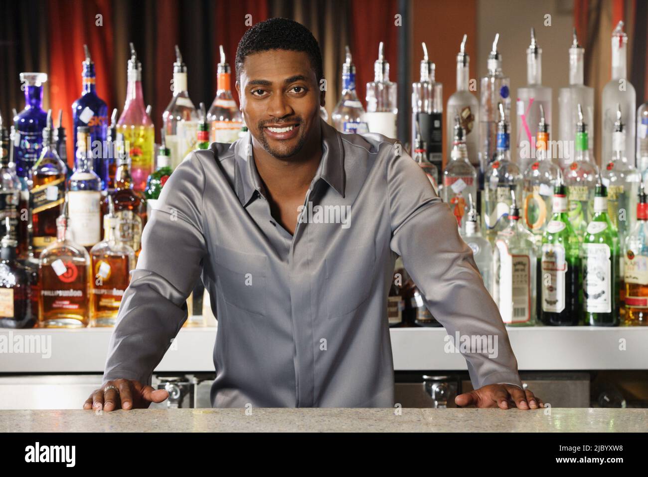 Bartender leaning on counter hi-res stock photography and images - Alamy