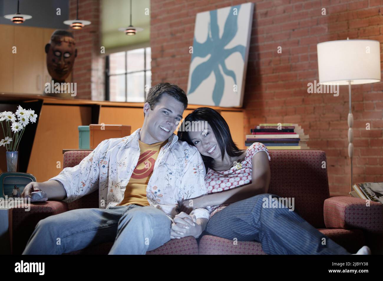 Asian hispanic couple tv hi-res stock photography and images - Alamy