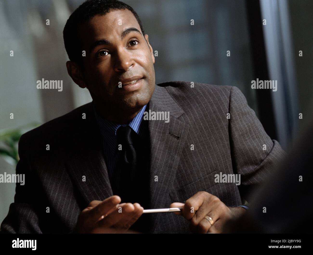 African American businessman holding pen Stock Photo - Alamy African American businessman holding pen Stock Photo - Alamy