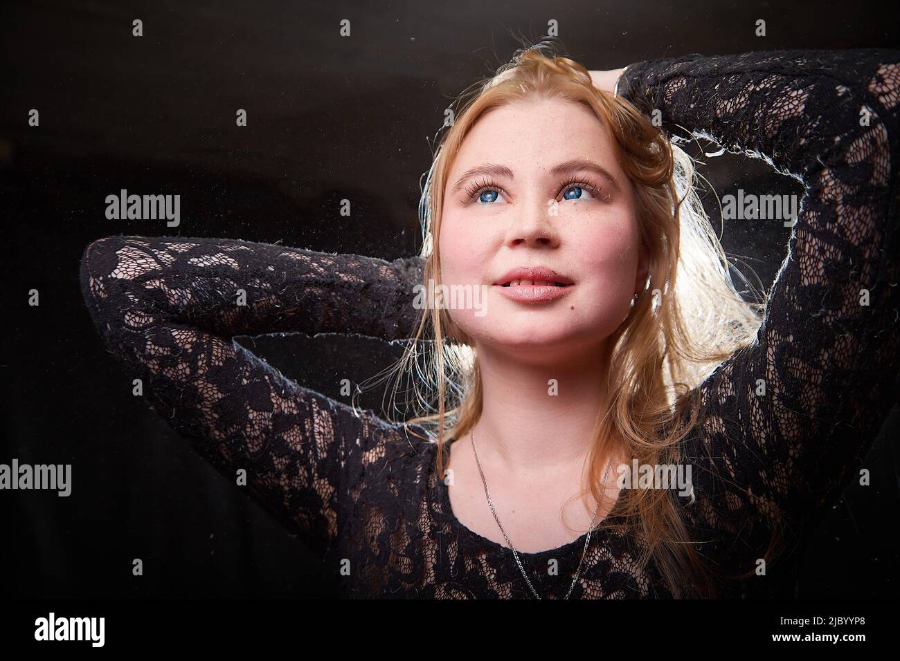 Portrait of young woman with long hair. Girl on calm face covered with ...