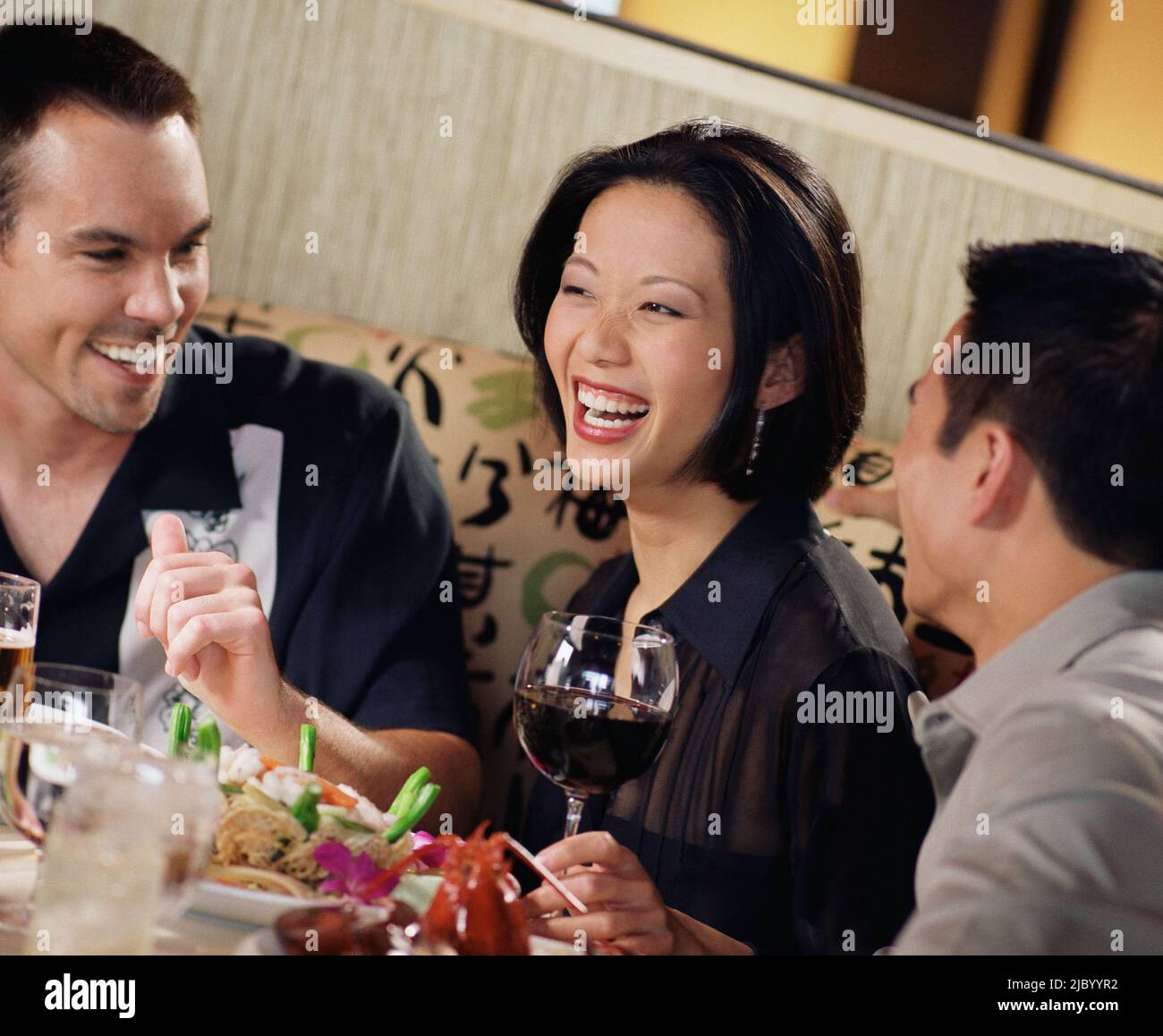 Cheerful asian lady enjoying dinner hi-res stock photography and images ...