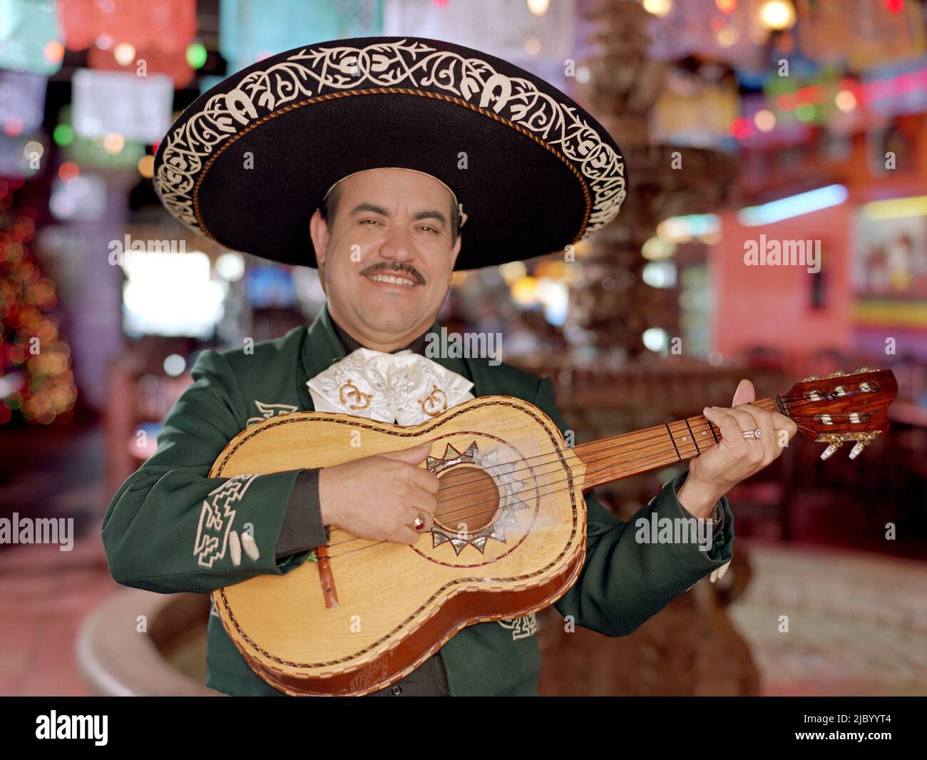 Hispanic mariachi musician playing guitar Stock Photo - Alamy