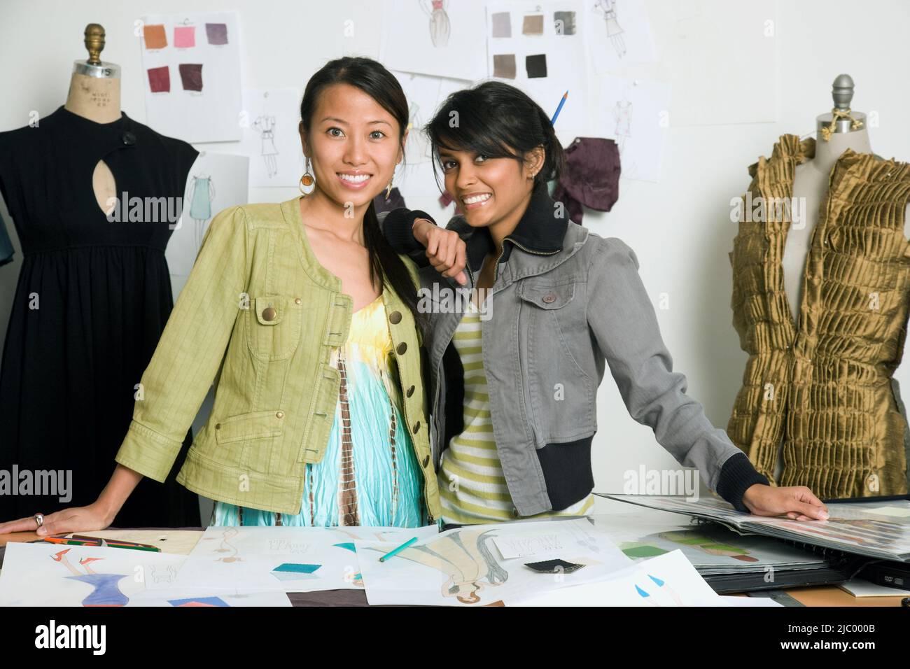 Fashion designers standing by model hi-res stock photography and images ...