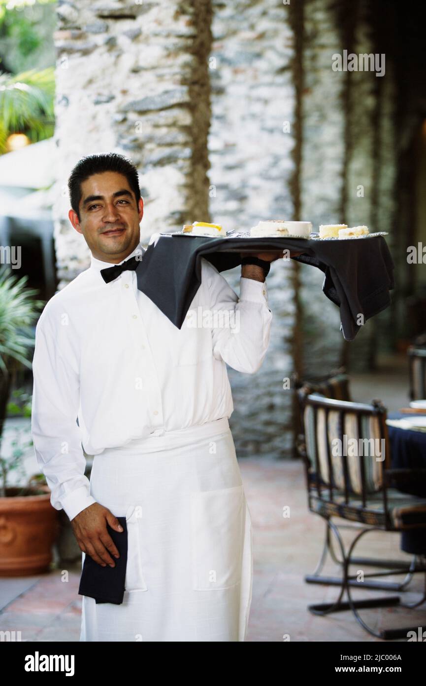Waiter Carrying A Tray At Bette Reese Blog