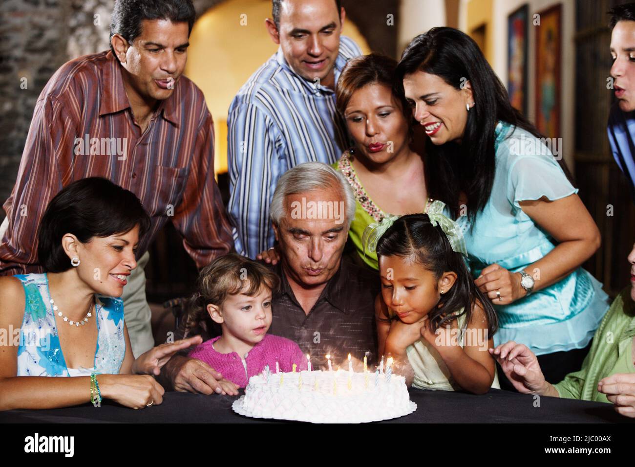 Extended family celebrating a birthday Stock Photo - Alamy