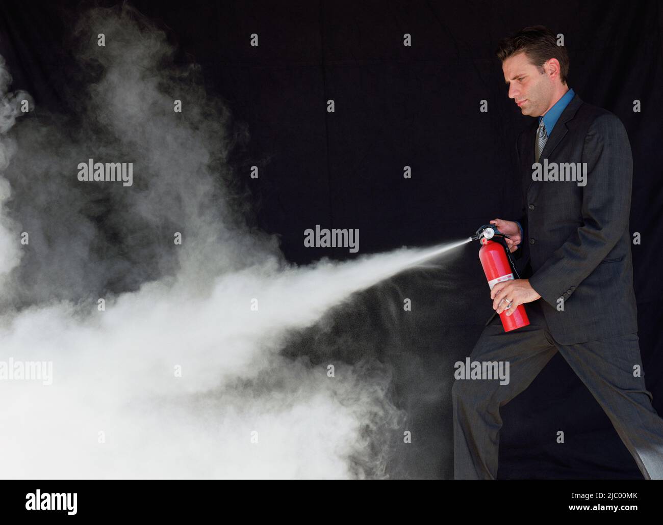 Person using fire extinguisher hi-res stock photography and images - Alamy
