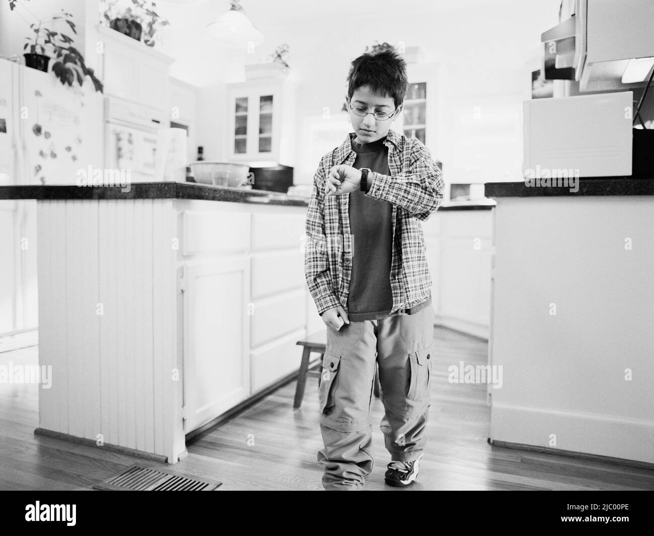 Child looking at watch wristwatch hi-res stock photography and images ...