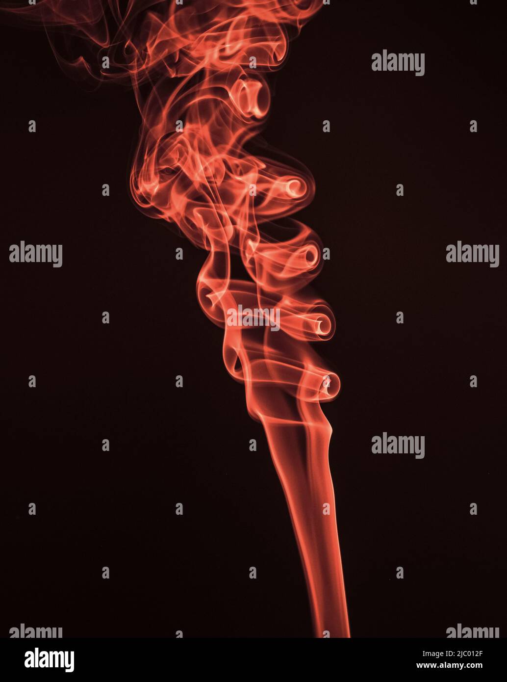 Wisp of red smoke spiraled abstract steaming maroon background, steam ...