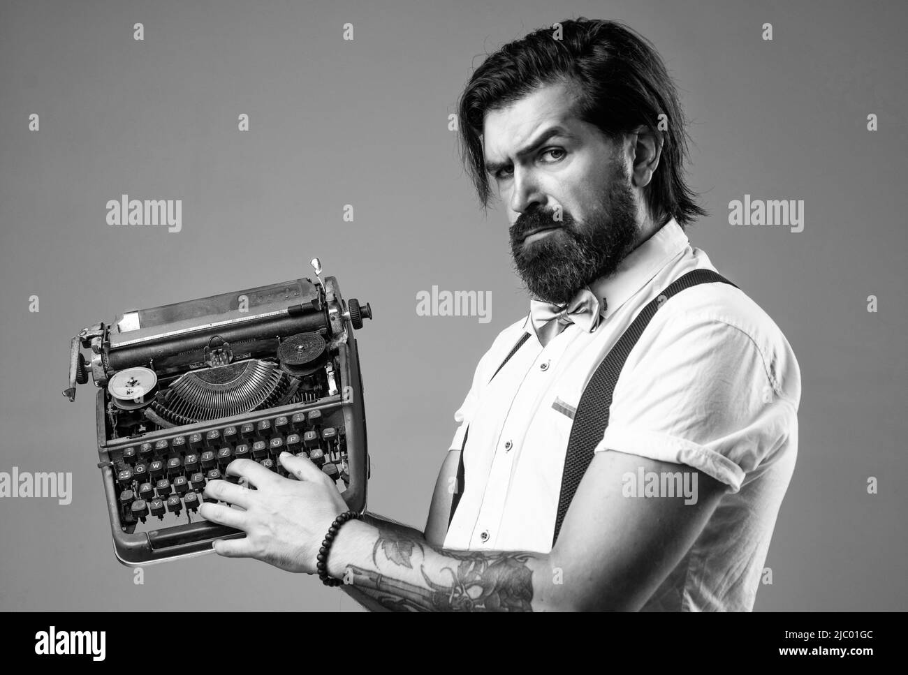 he is a writer. brutal guy in bow tie. elegant male typist. handsome ...