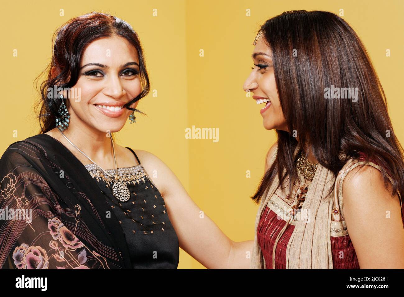 Portrait of two women smiling Stock Photo - Alamy