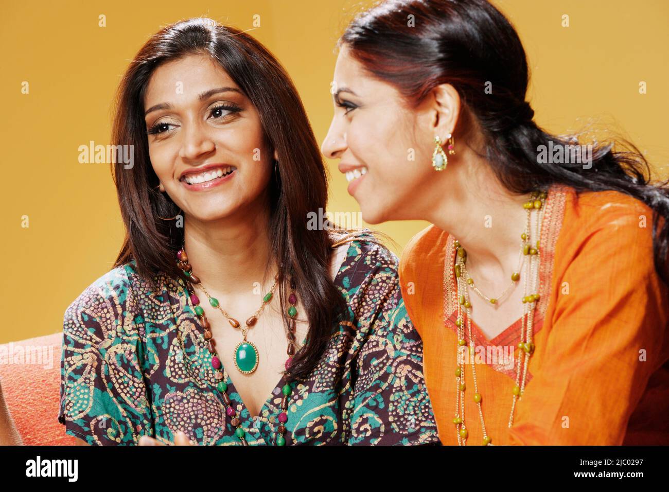 Portrait of two women smiling Stock Photo - Alamy