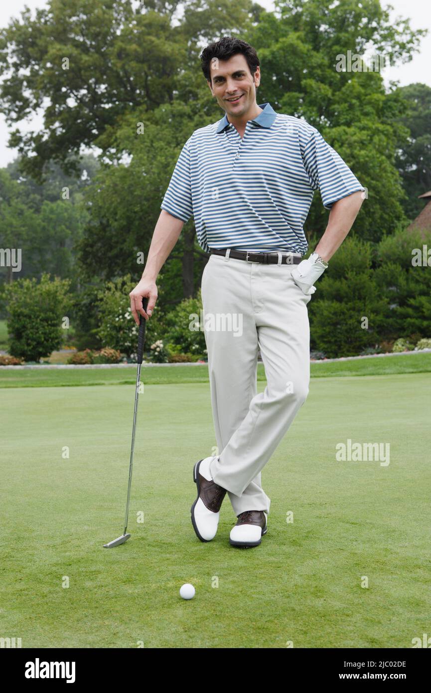 Portrait of man on golf course Stock Photo - Alamy