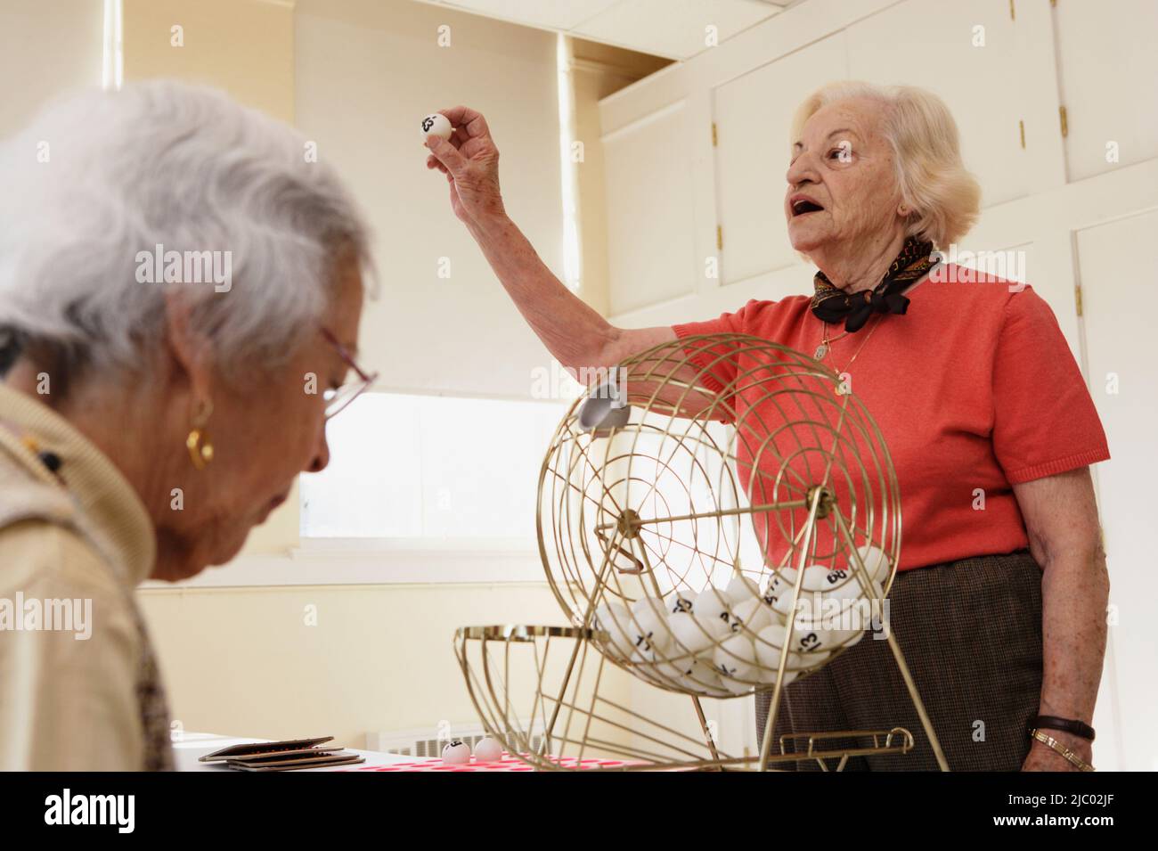 Elderly woman playing bingo Stock Photo - Alamy