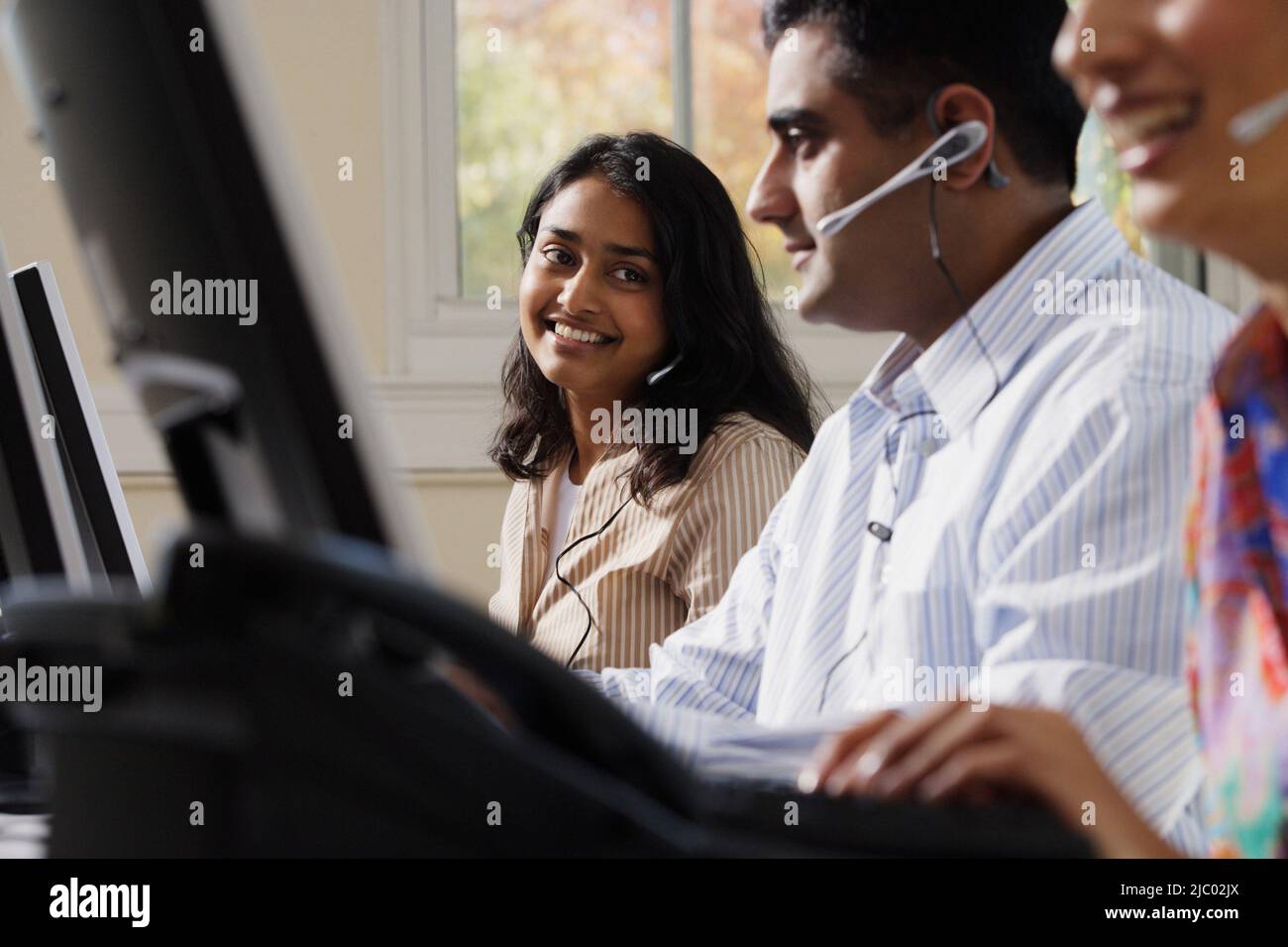 Business people headsets using computers hi-res stock photography and ...