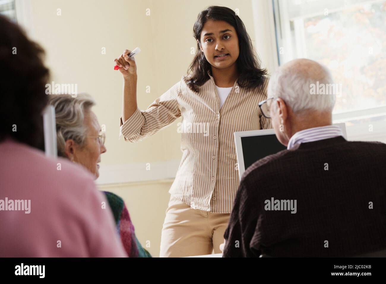 Elderly people taking a computers class Stock Photo - Alamy