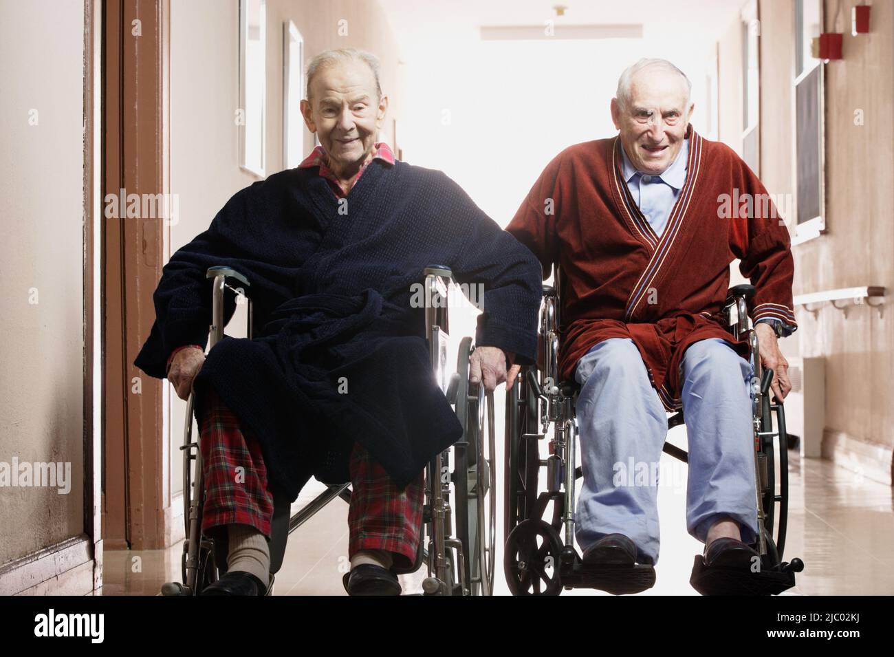 Elderly men racing in wheelchairs Stock Photo - Alamy