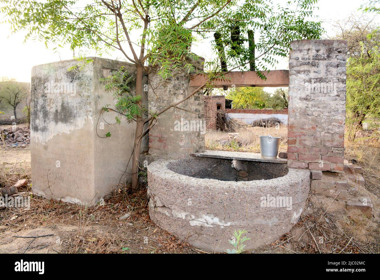 An old stone water well in the countryside Stock Photo - Alamy
