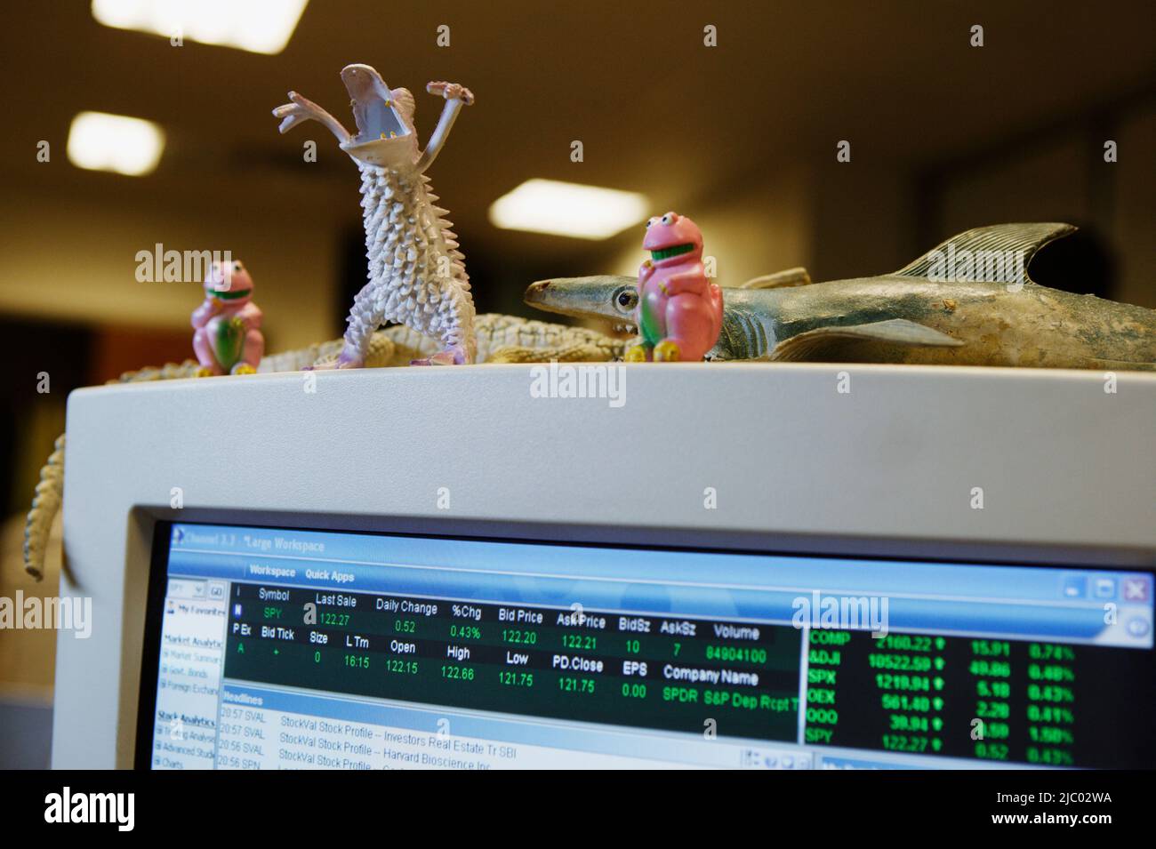 Toys adorning computer screen Stock Photo - Alamy
