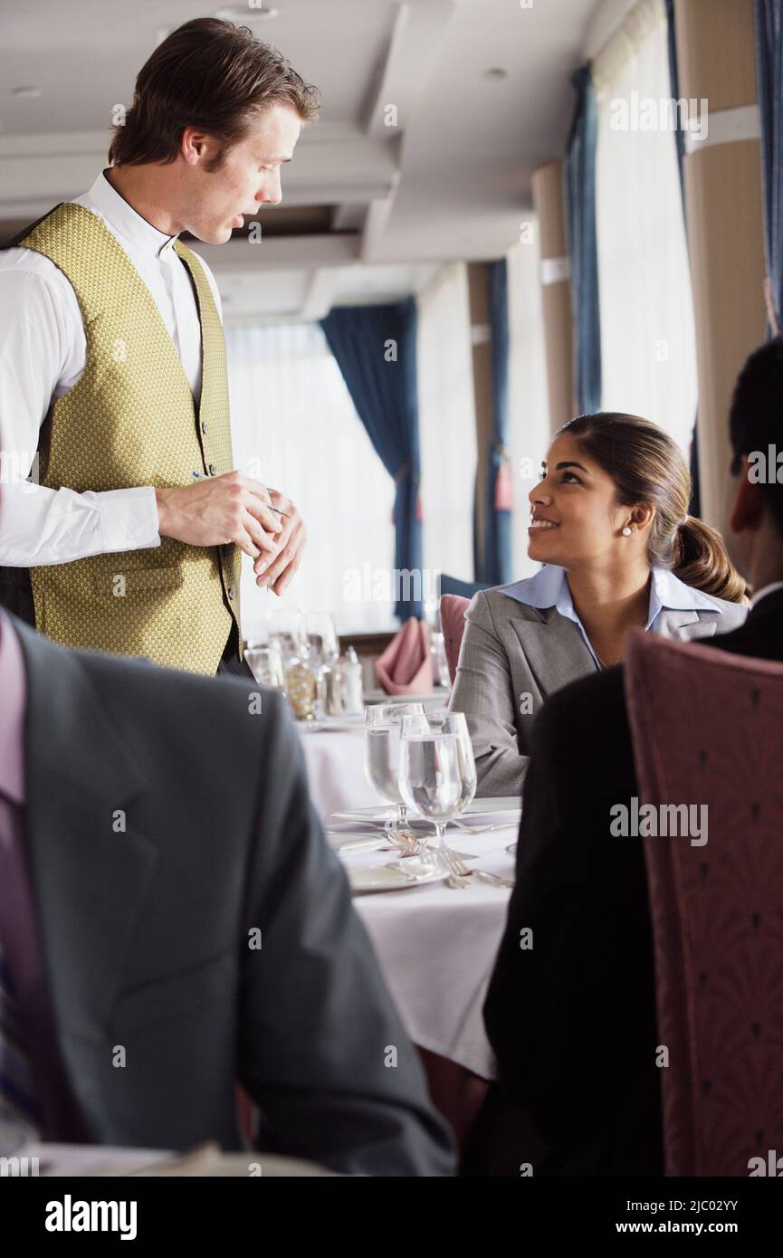 Asian male waiter taking order hi-res stock photography and images - Alamy