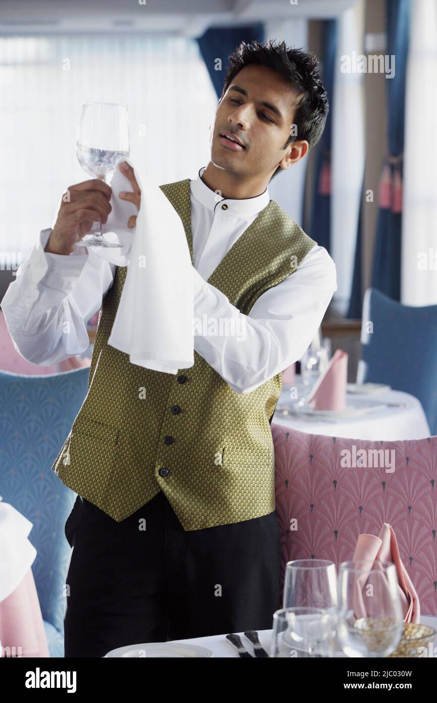 Waiter cleaning wine glass in hi-res stock photography and images - Alamy