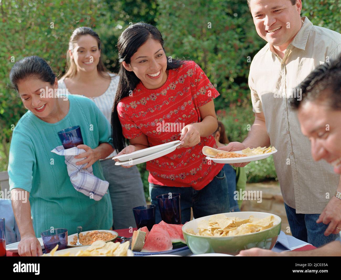 People eating at a party Stock Photo - Alamy