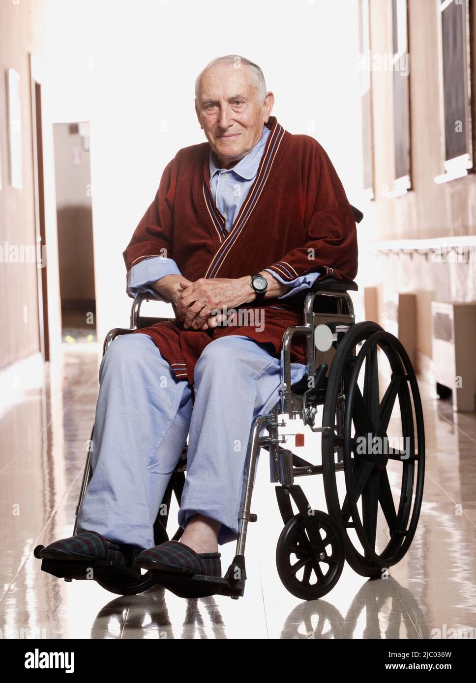 Elderly man smiling for the camera in a wheelchair Stock Photo - Alamy