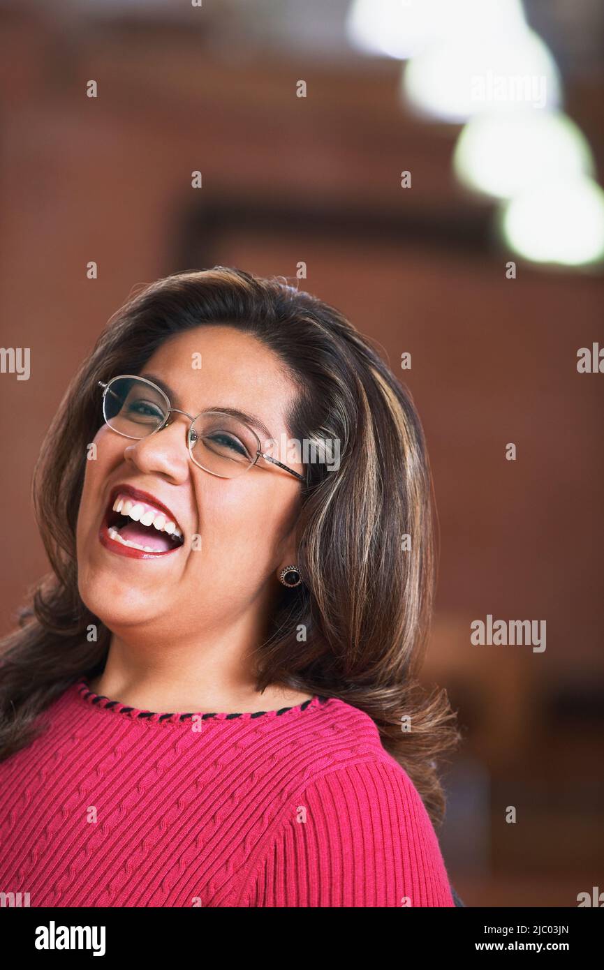 Middle-aged woman laughing Stock Photo - Alamy