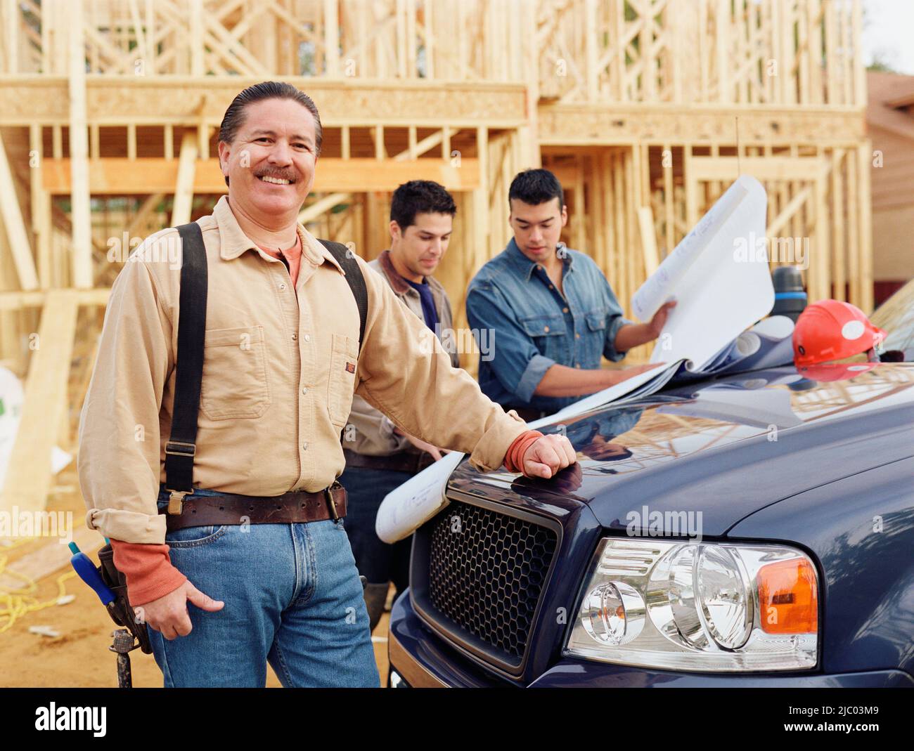 Delighted construction worker standing hi-res stock photography and ...