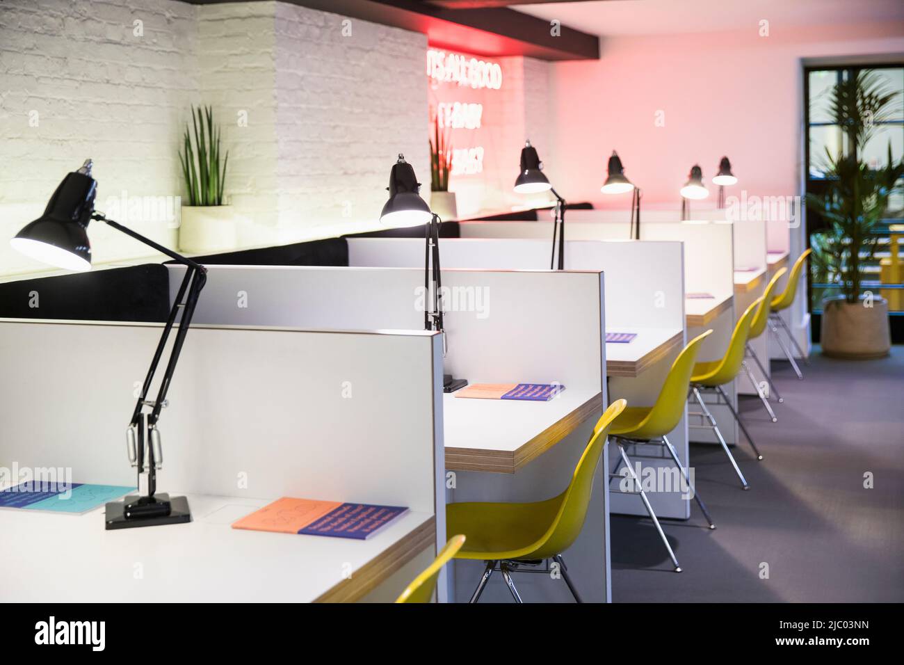 Detail of row of individual work stations in shared office space Stock ...