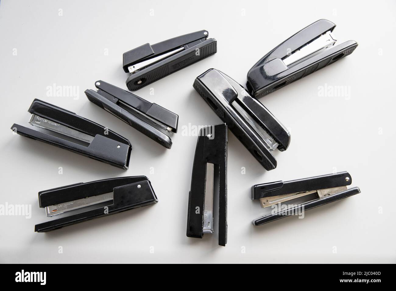 Overhead shot of eight staplers Stock Photo - Alamy