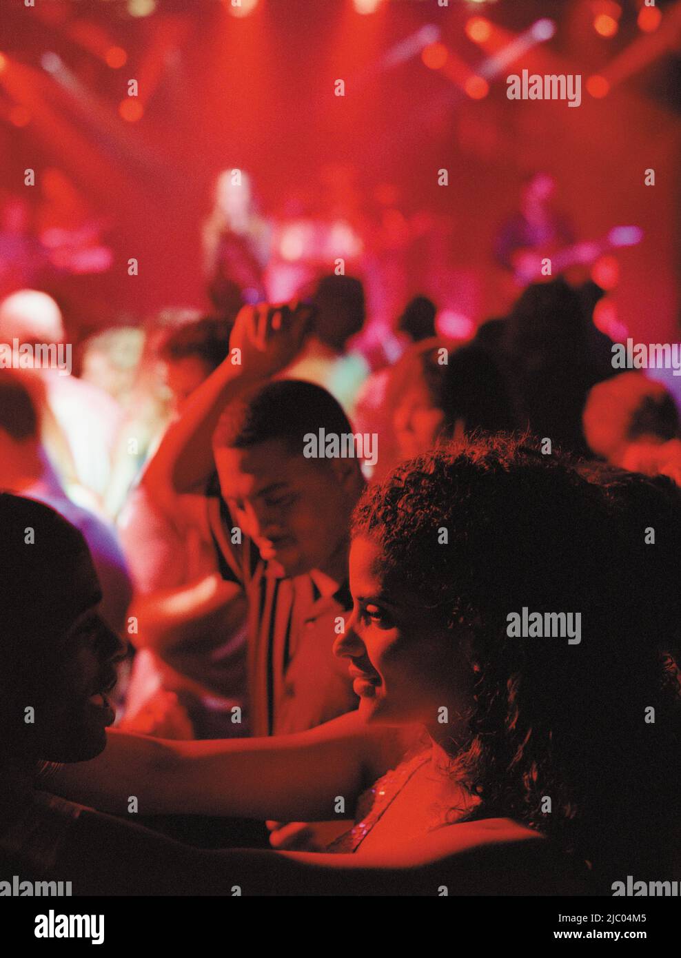 Couples dancing at night club Stock Photo - Alamy