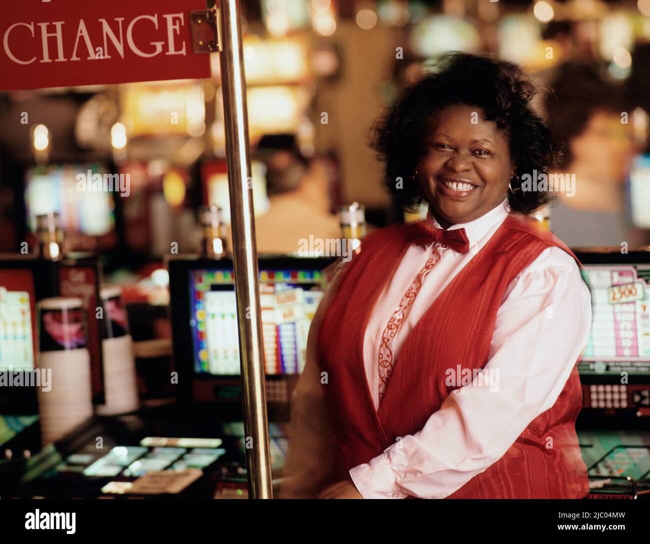Female cashier at register Stock Photo - Alamy