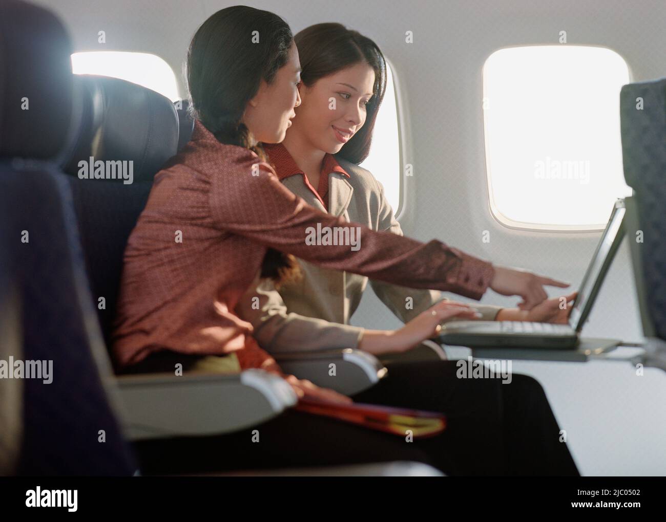 Mom and daughter on plane hi-res stock photography and images - Alamy