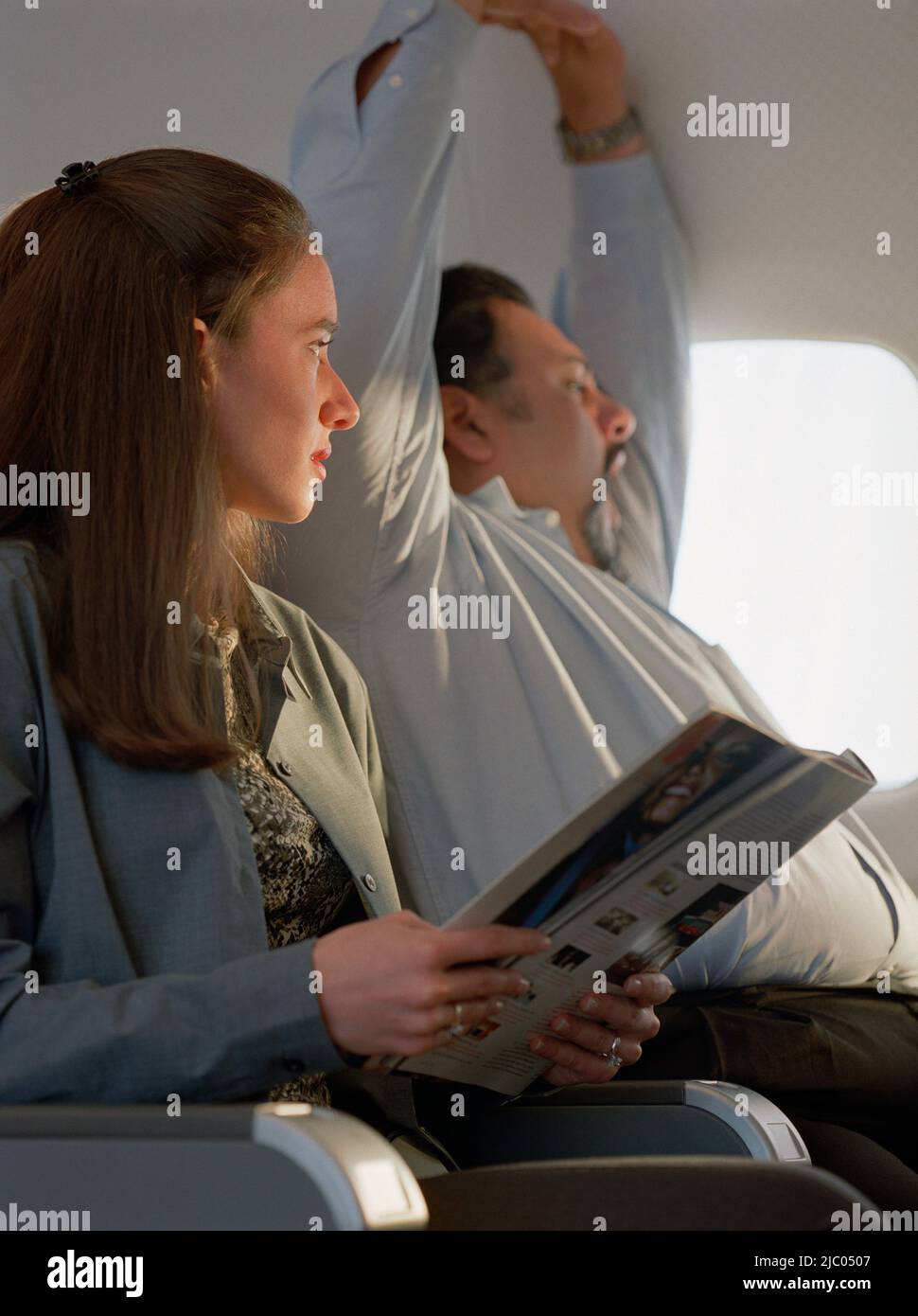 Senior overweight man yawning on airplane Stock Photo - Alamy