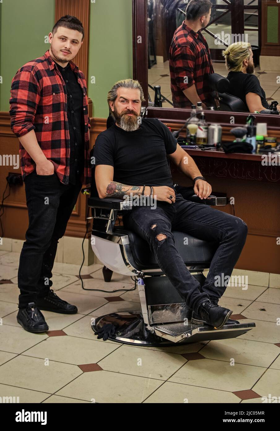 hair cut and beard care for caucasian guy in barbershop, stylist Stock ...